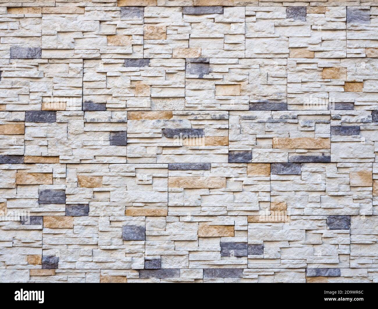Frontal view of a wall with decorative masonry. Background texture ...