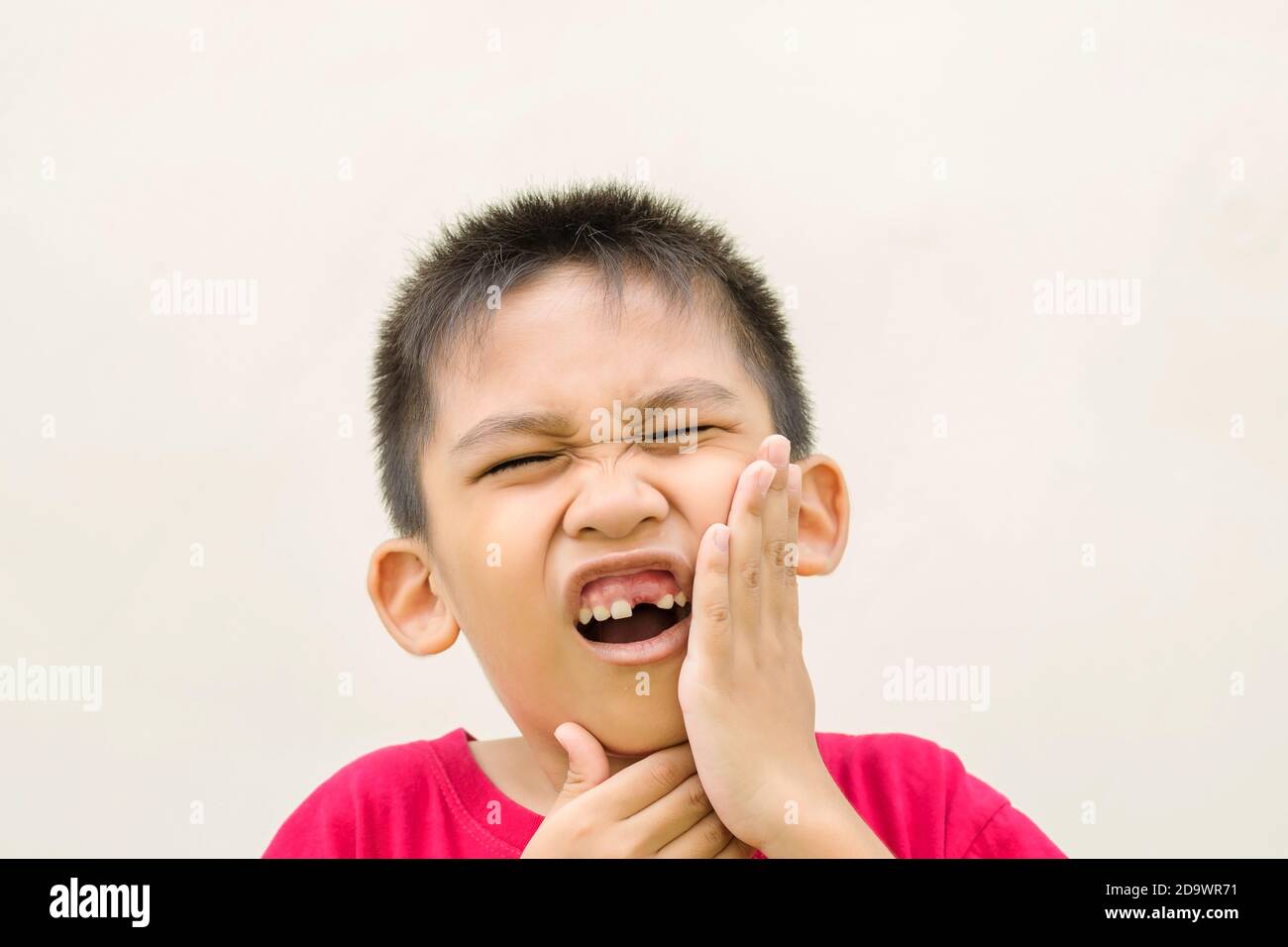 Close up in front of a boy singing in pain because of toothache Stock ...