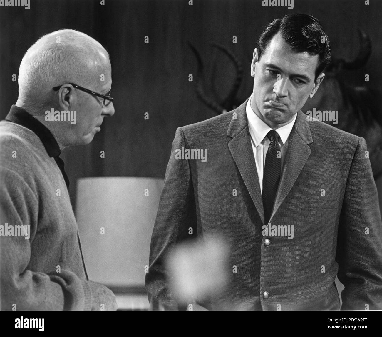 Director HOWARD HAWKS and ROCK HUDSON on set candid during filming of ...