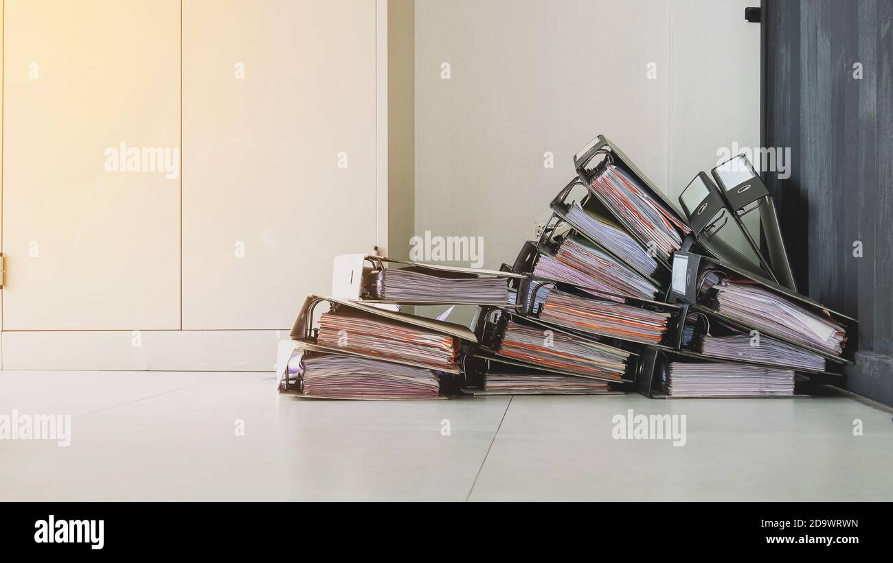 Many office documents are stacked on the floor Stock Photo - Alamy