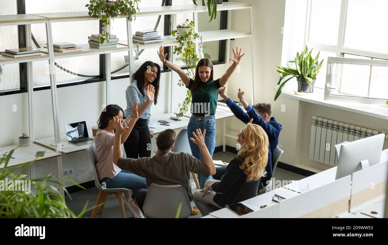 Happy excited diverse teammates friends having fun meeting in office ...
