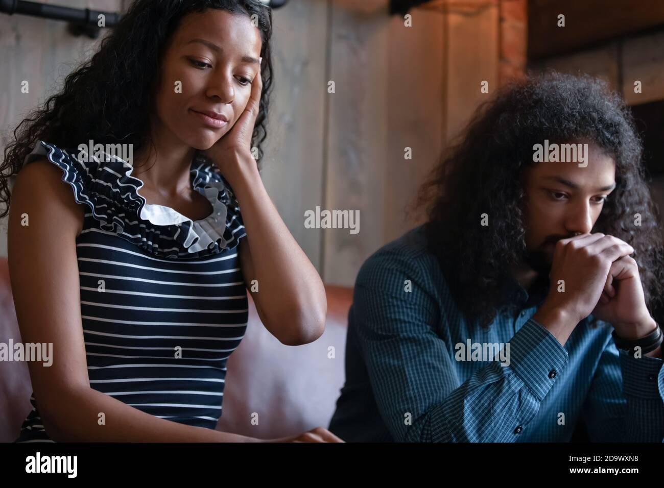 Sad millennial family sitting on sofa falling in heavy thoughts Stock ...