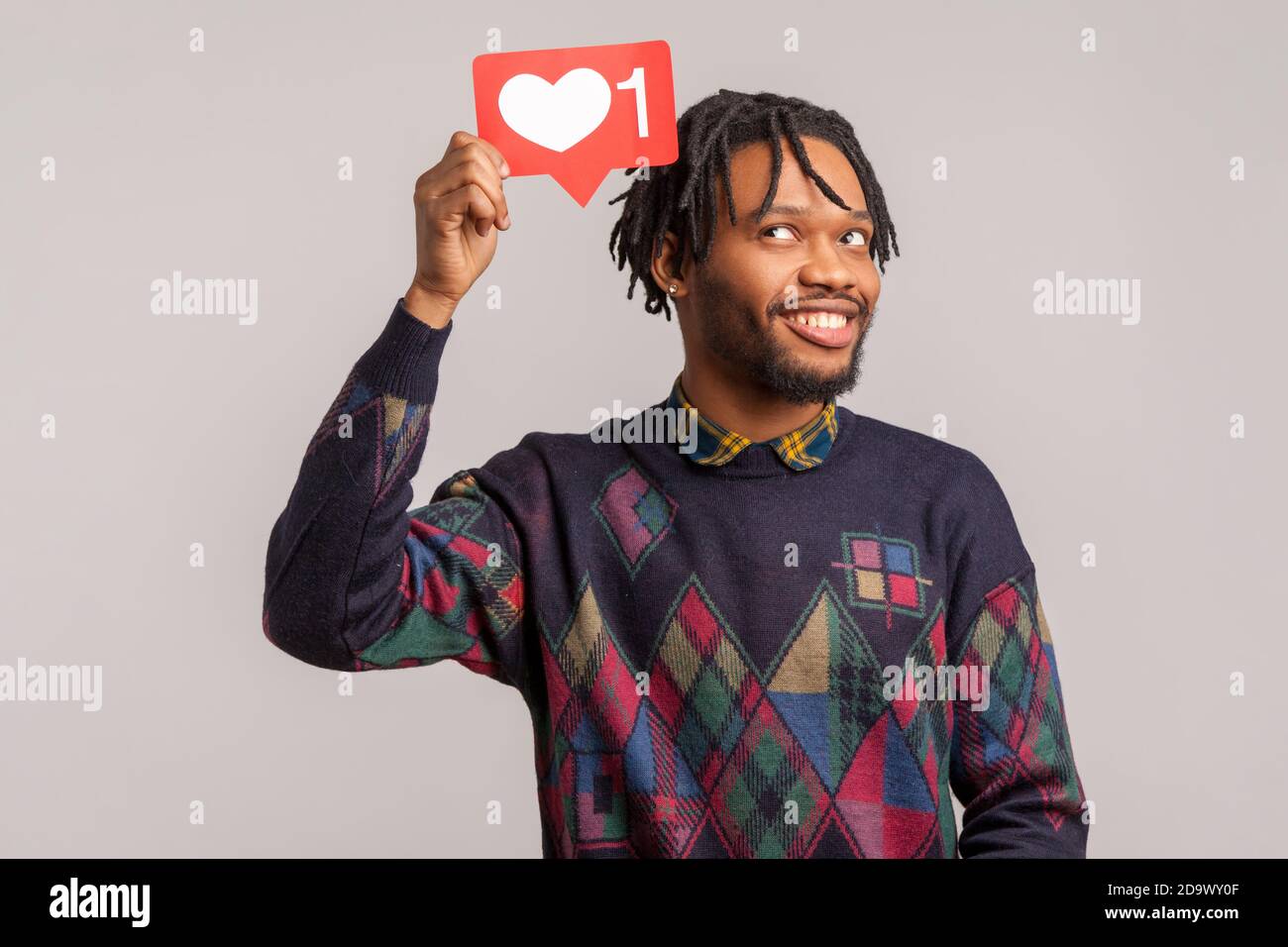 Satisfied wondered african guy looking at like counter button, smiling ...
