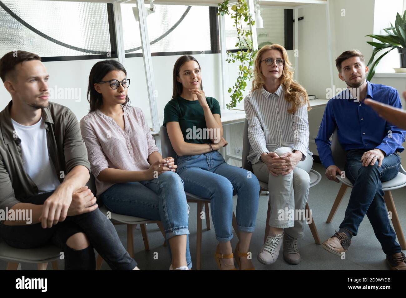 Group of people listening to lecture provided by qualified teacher ...