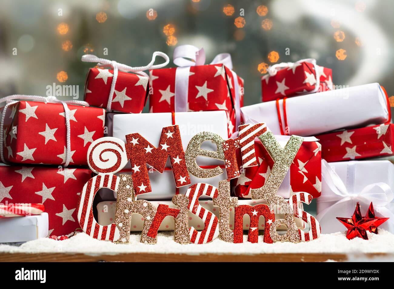 Wrapped Christmas presents with festive illuminated background ...