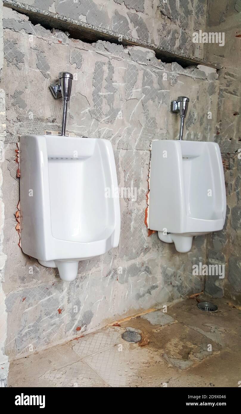 New urinal in men's bathroom was under construction Stock Photo - Alamy