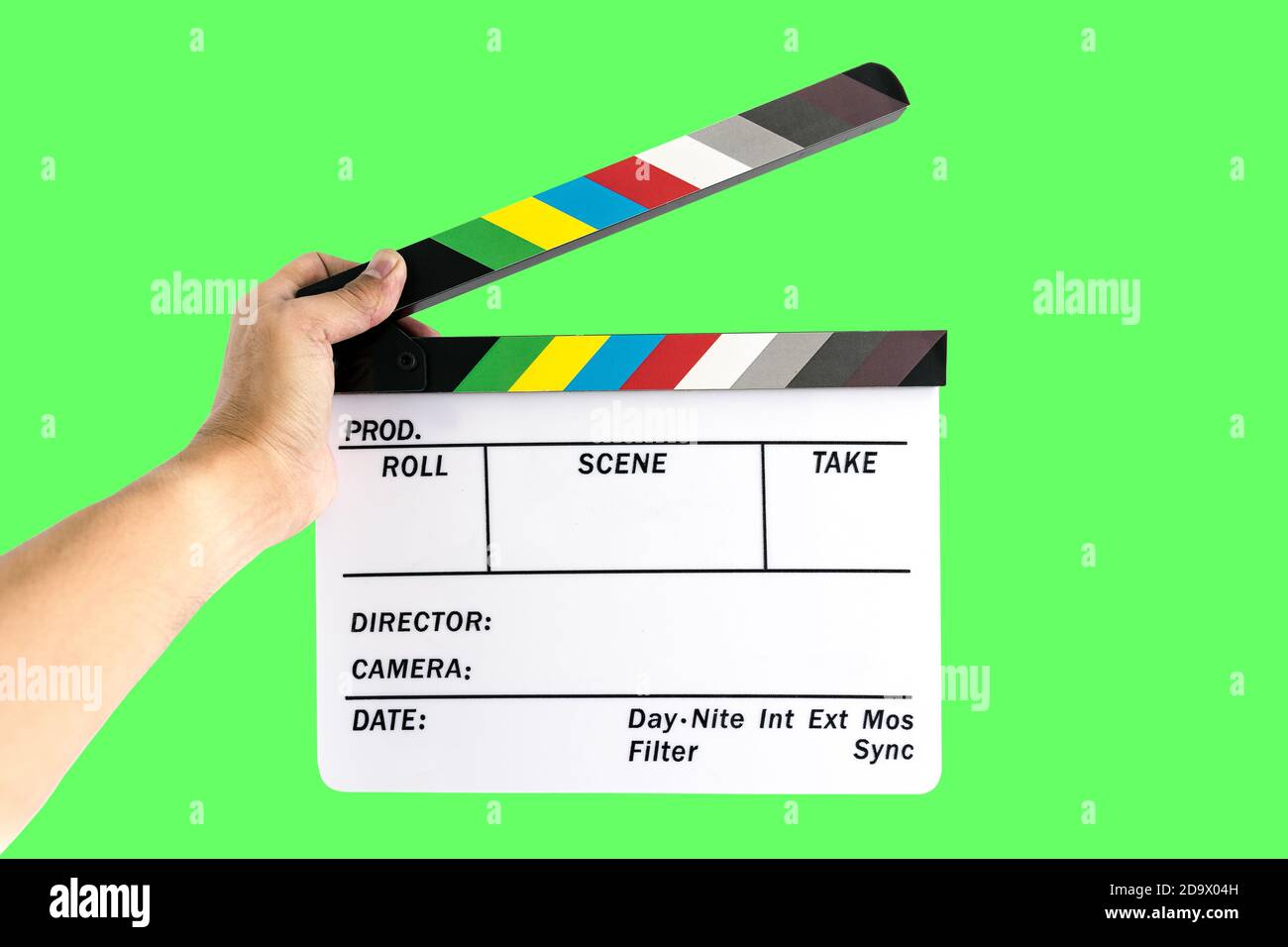 Men's hand holding camera slate for the filming isolated on green ...