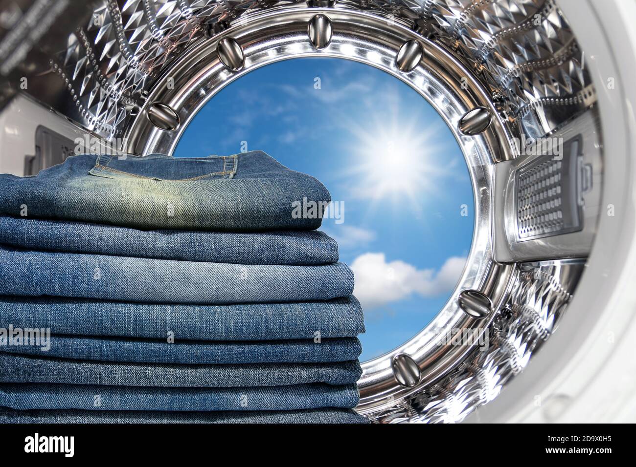 Closeup group of blue jeans inside the washing machine Stock Photo - Alamy