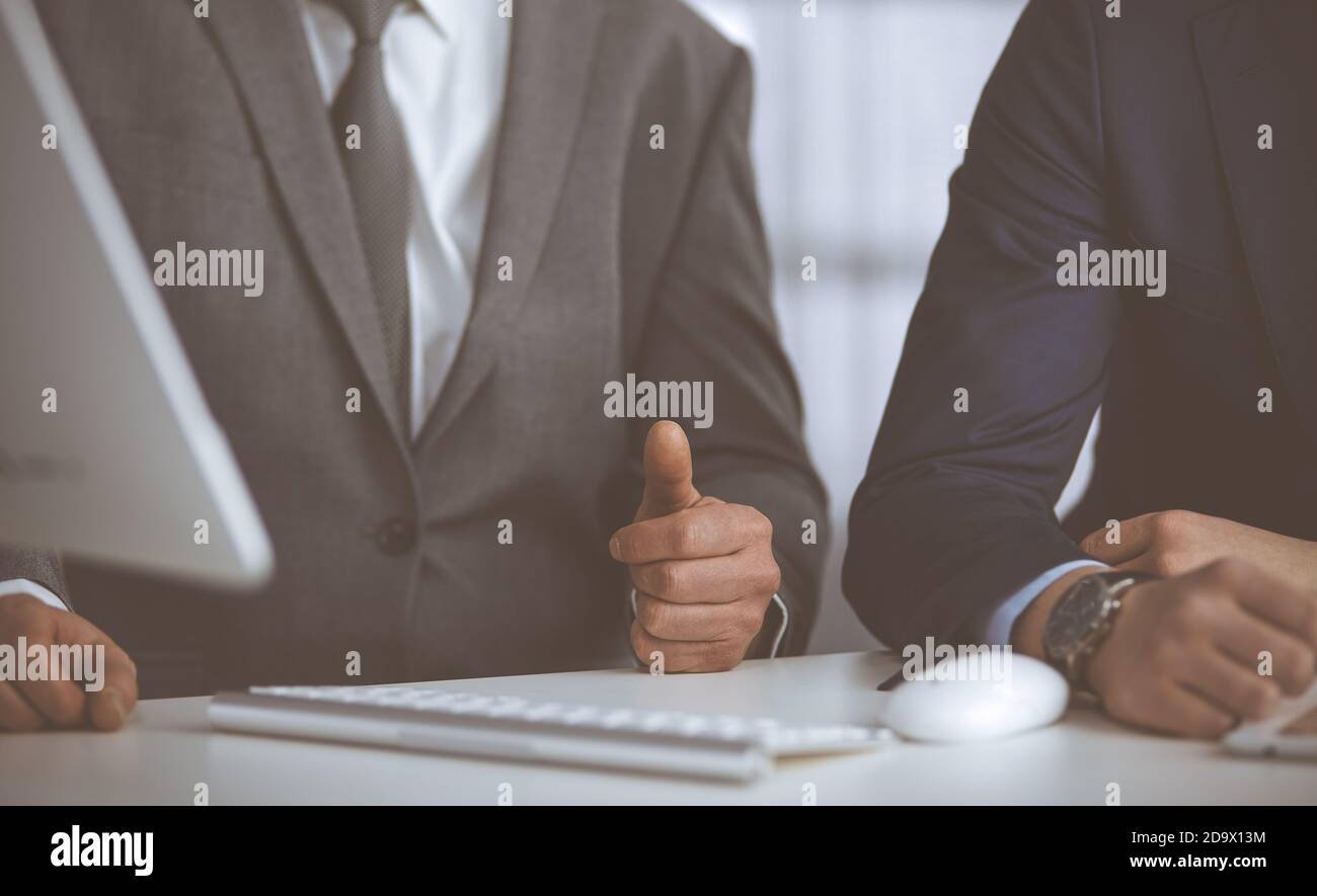Business people using computer while working together in modern office ...