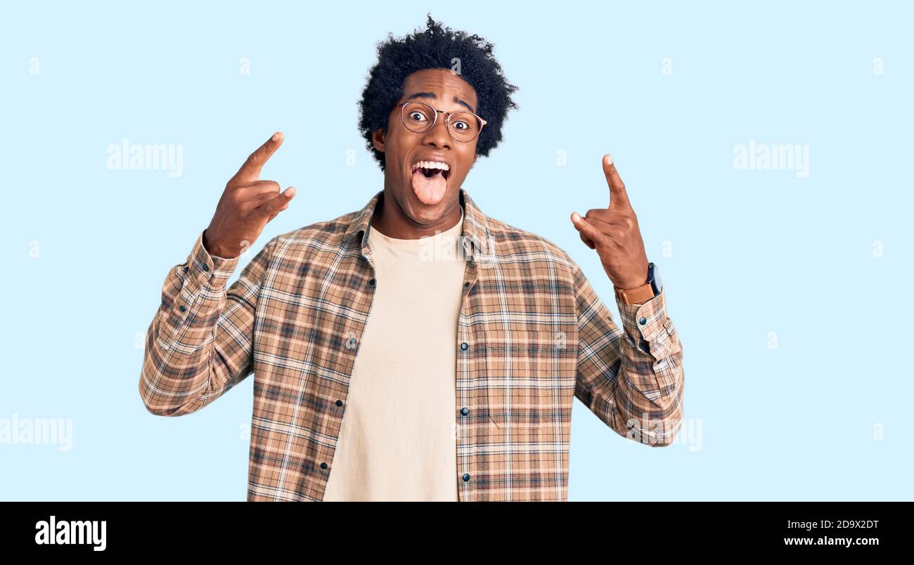 Handsome african american man with afro hair wearing casual clothes and ...