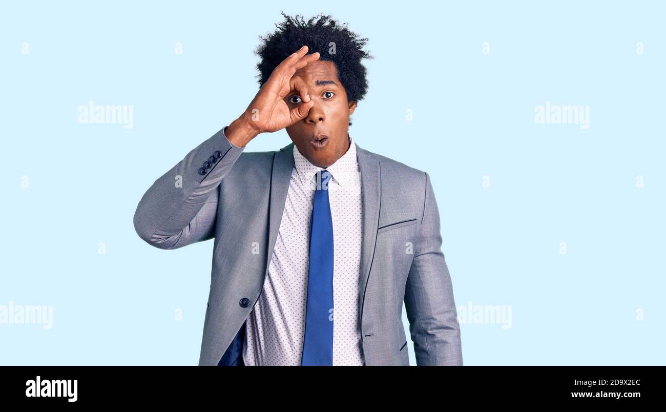 Handsome african american man with afro hair wearing business jacket ...