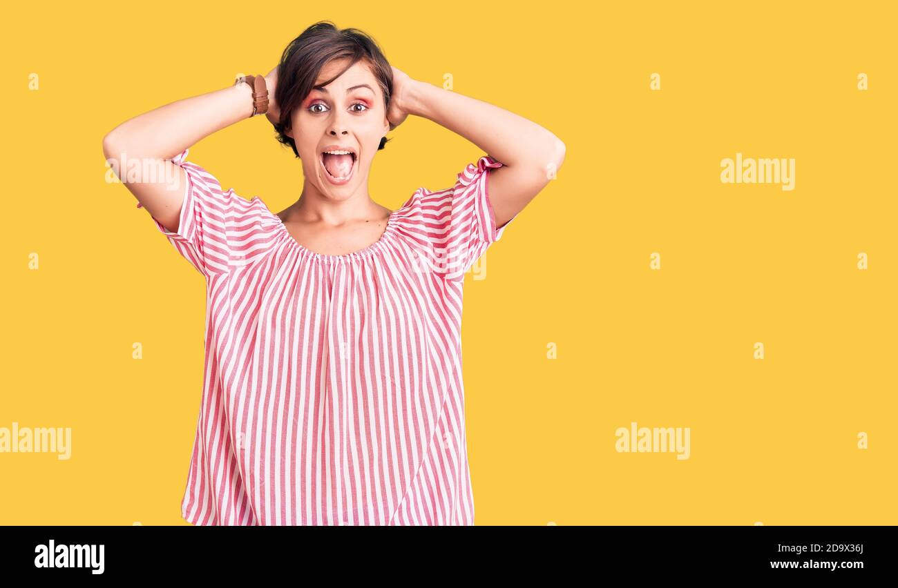 Beautiful young woman with short hair wearing casual summer clothes ...