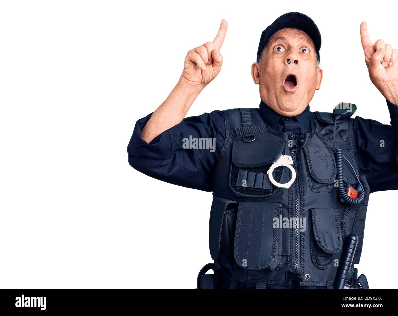 Senior handsome man wearing police uniform amazed and surprised looking ...