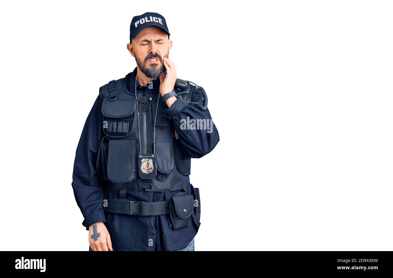 Young handsome man wearing police uniform touching mouth with hand with ...