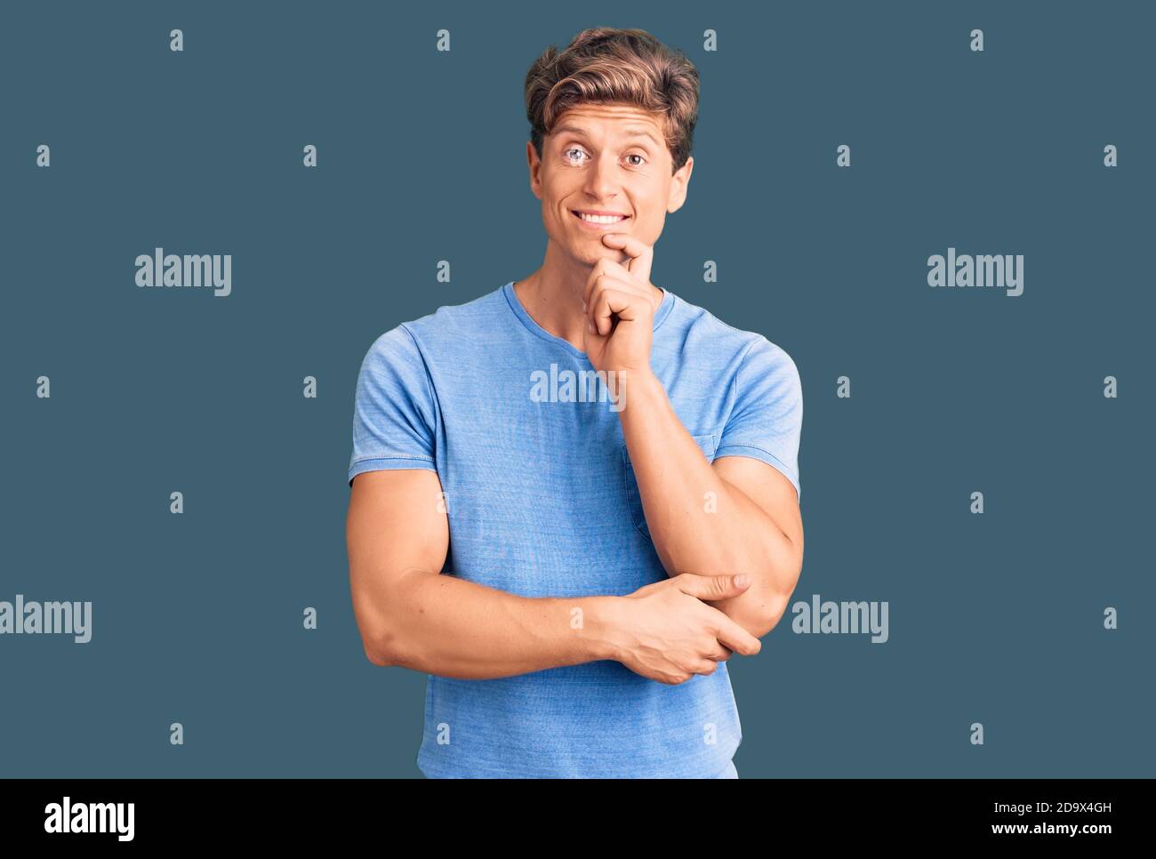 Young handsome man wearing casual clothes looking confident at the ...