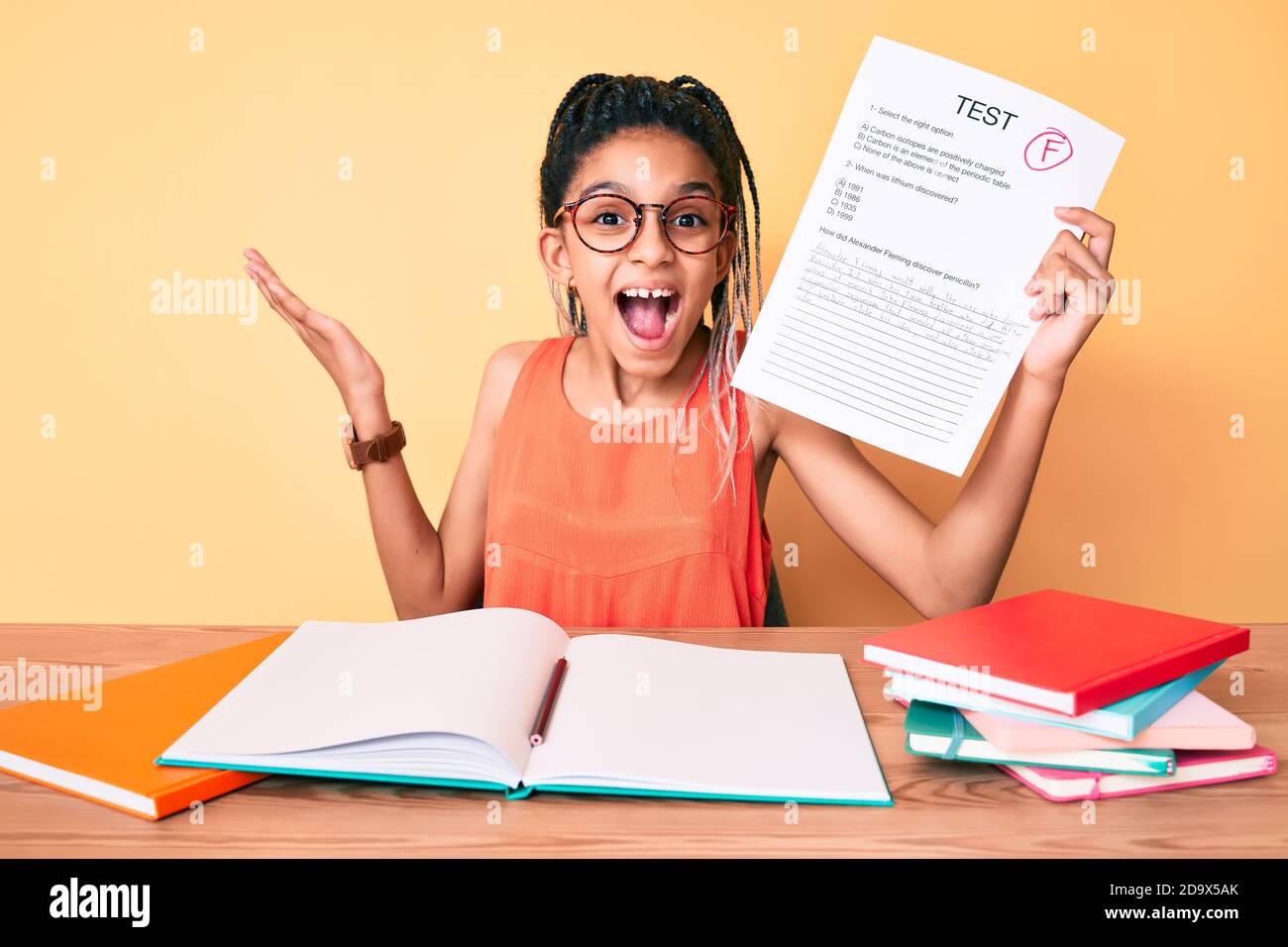 Young african american girl child with braids showing failed exam ...