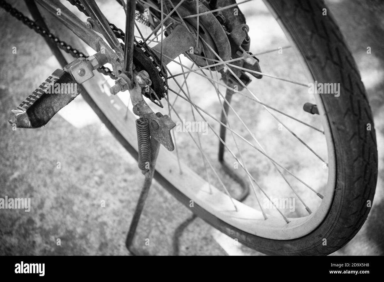 Closeup of the old and rusty bicycle chain, black and white tone filter ...