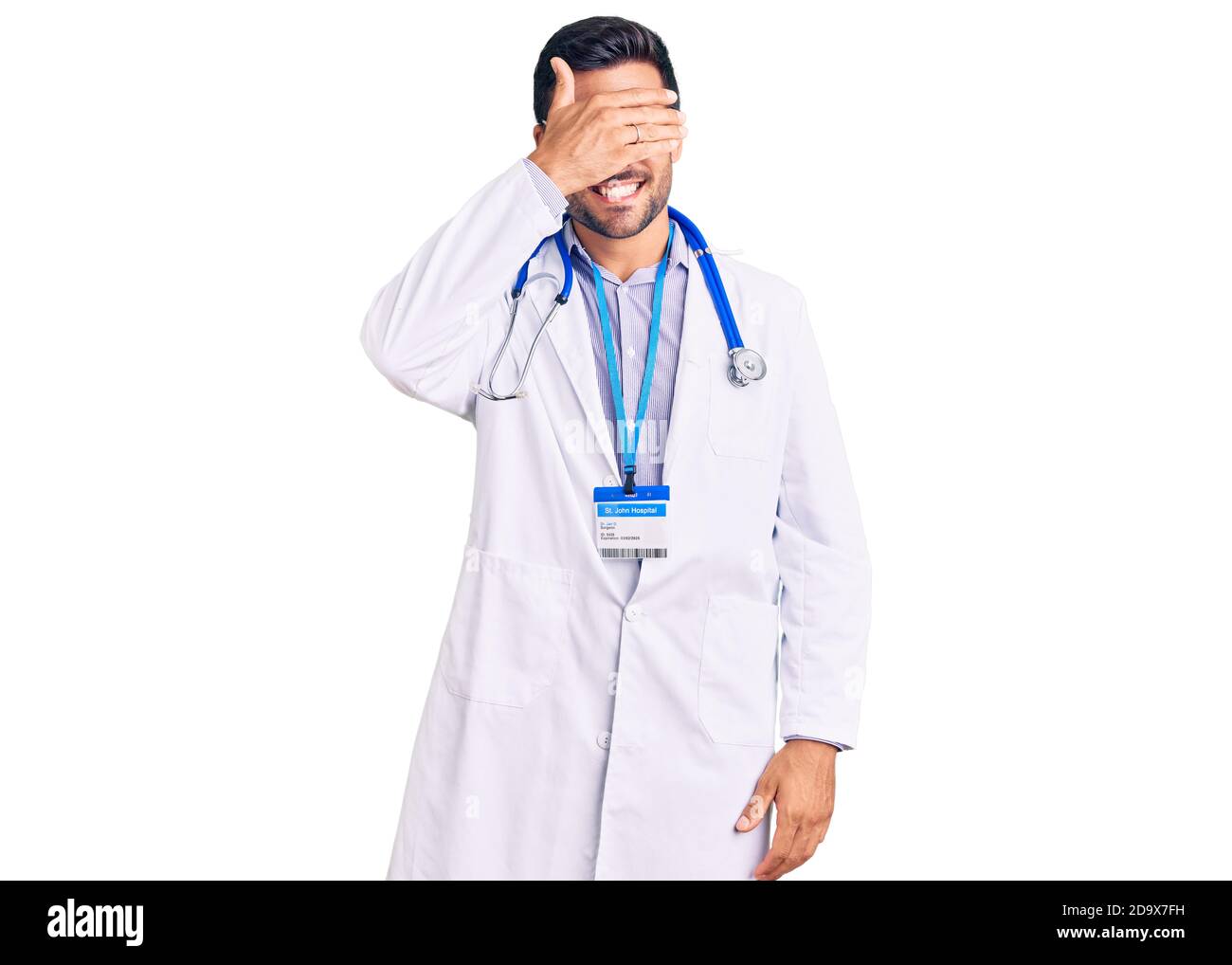 Young hispanic man wearing doctor uniform and stethoscope smiling and ...