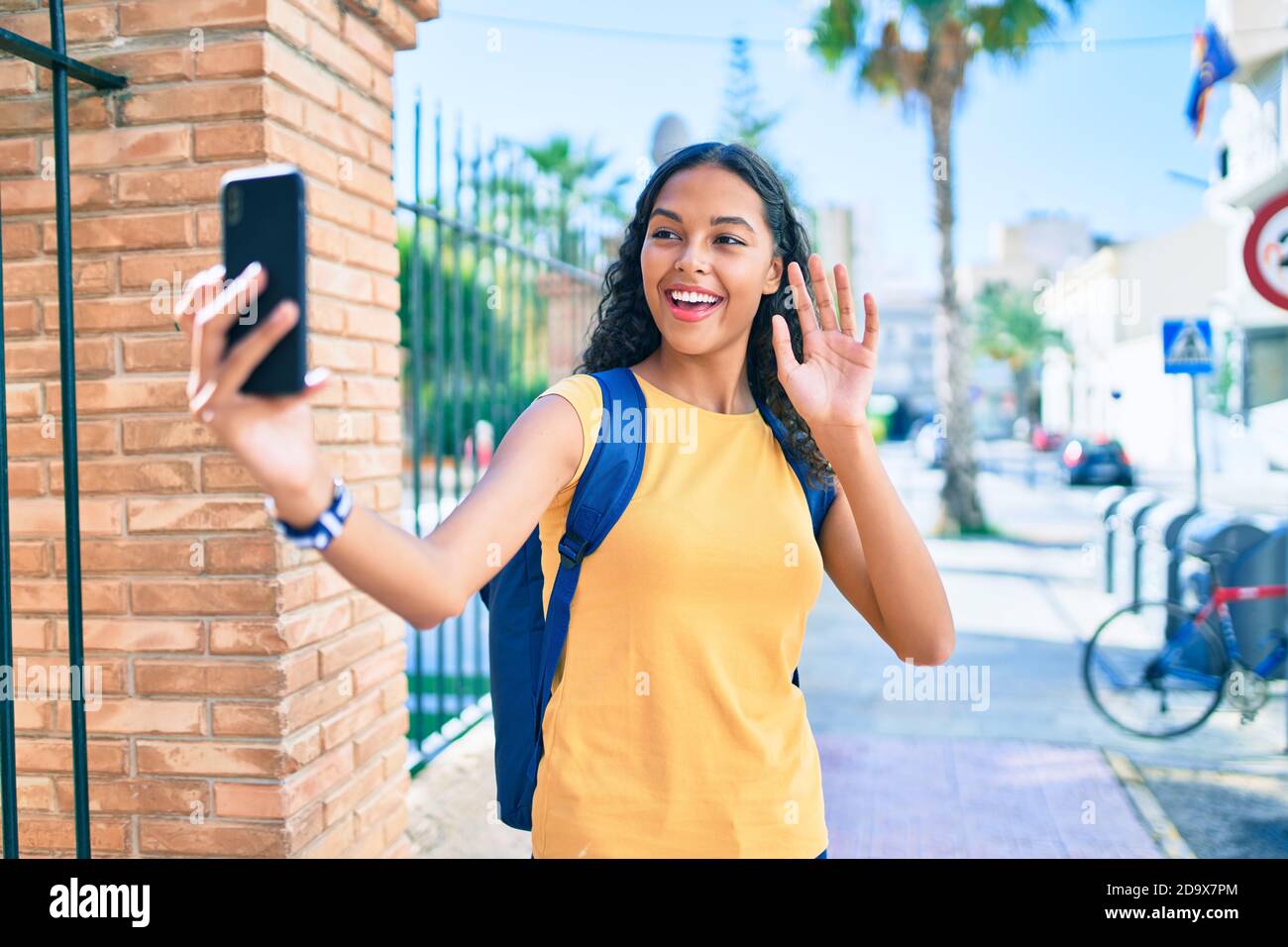Young african american student girl doing video call using smartphone ...