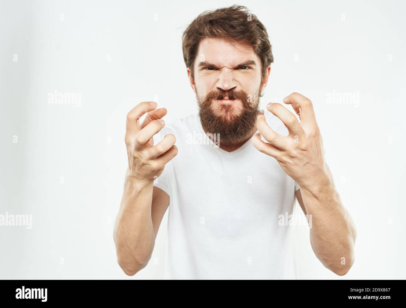 Aggressive man irritability emotions gesturing with model hands Stock ...