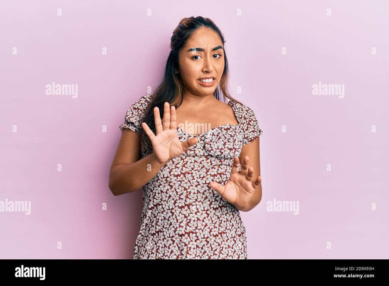 Young latin woman wearing casual clothes disgusted expression ...