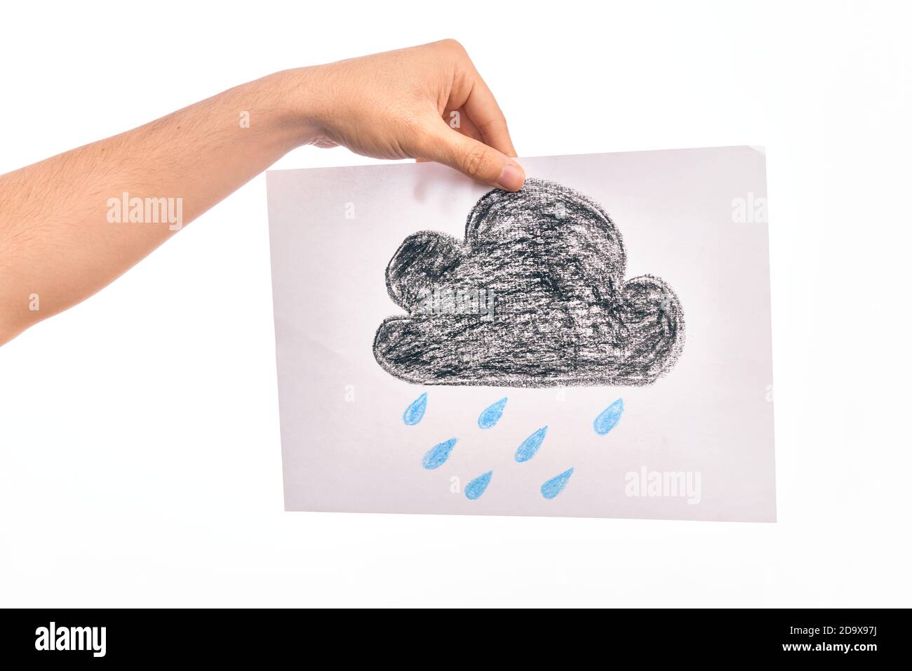 Holding paper sheet with a drawing of a dark cloud with drops, raining ...