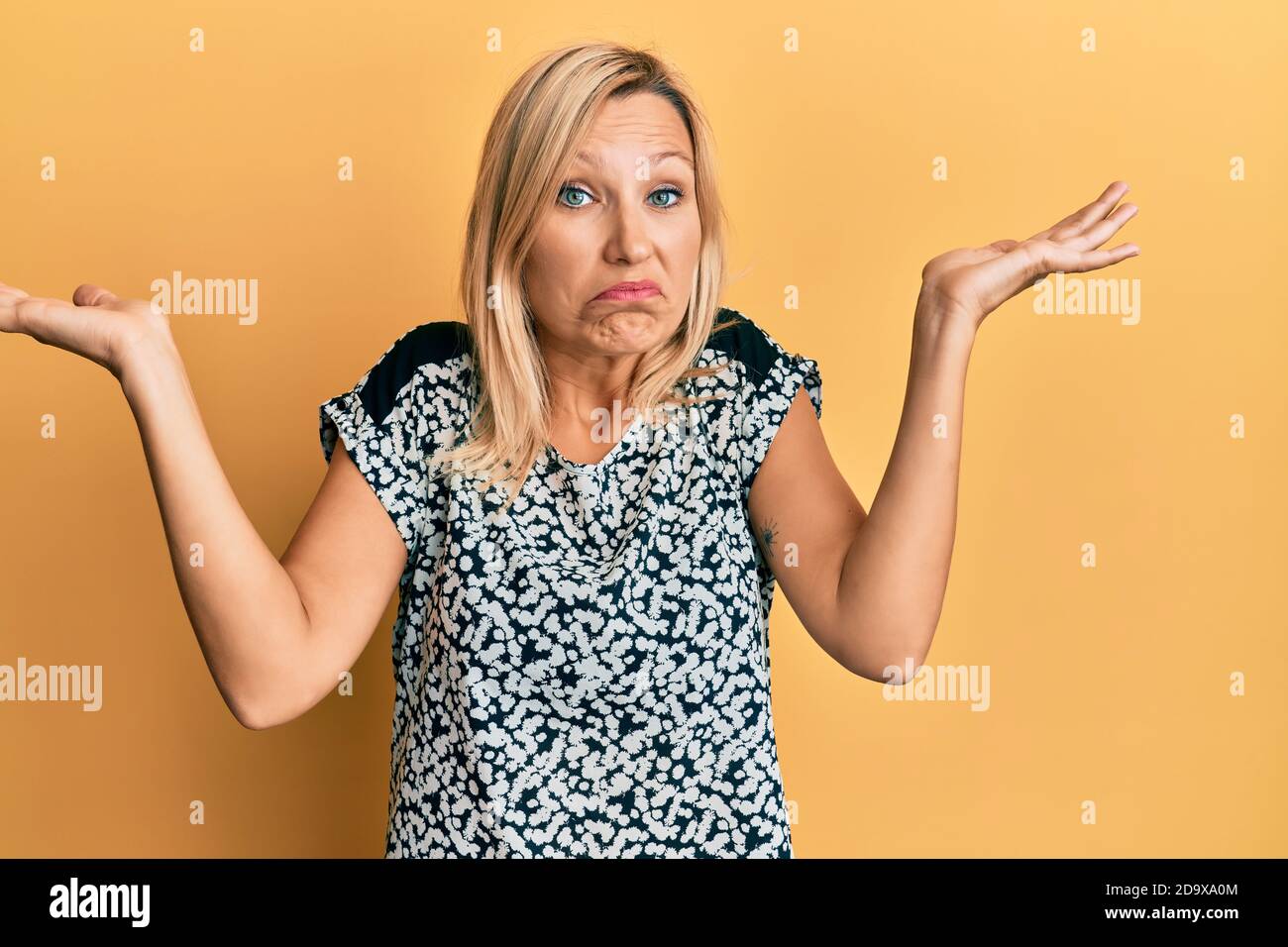 Middle age caucasian woman wearing casual clothes clueless and confused ...
