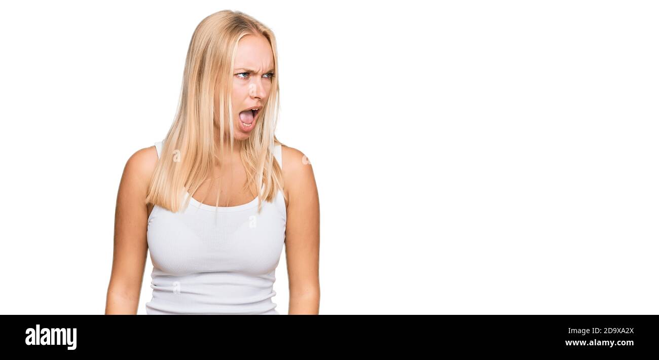 Young Blonde Girl Wearing Casual Style With Sleeveless Shirt Angry And