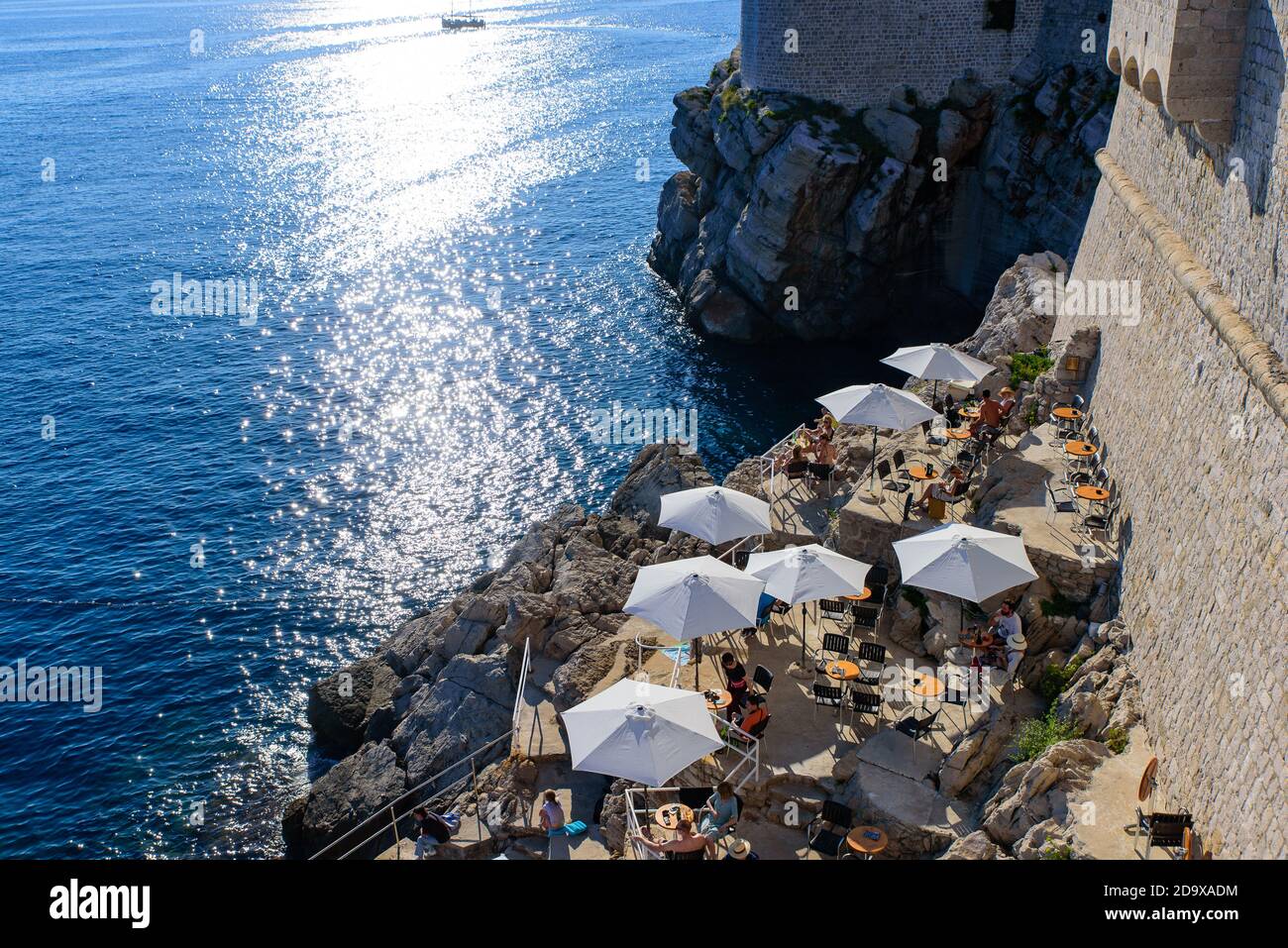 People enjoying the view at cliff-side bar in the old city of Dubrovnik ...