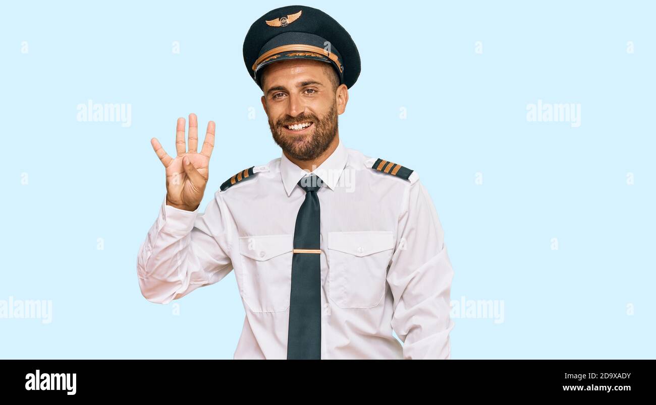 Handsome Man With Beard Wearing Airplane Pilot Uniform Showing And