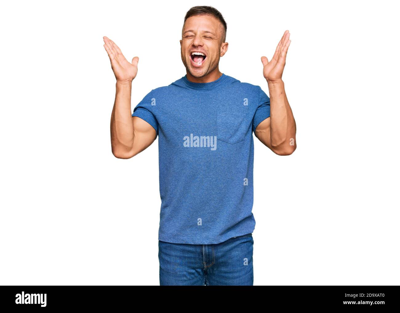 Handsome muscle man wearing casual clothes celebrating mad and crazy ...