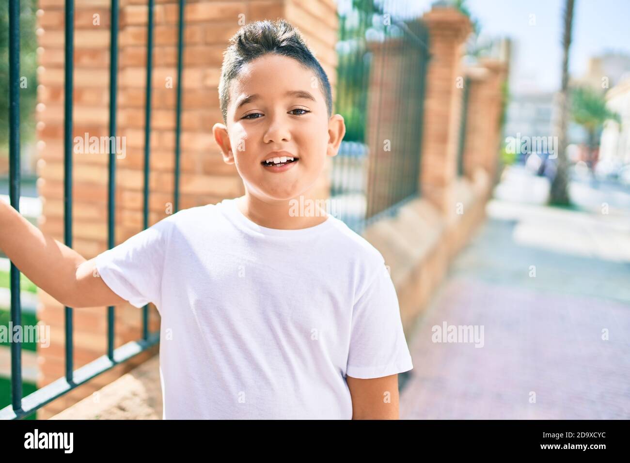 Adorable boy smiling happy standing at street of city Stock Photo - Alamy