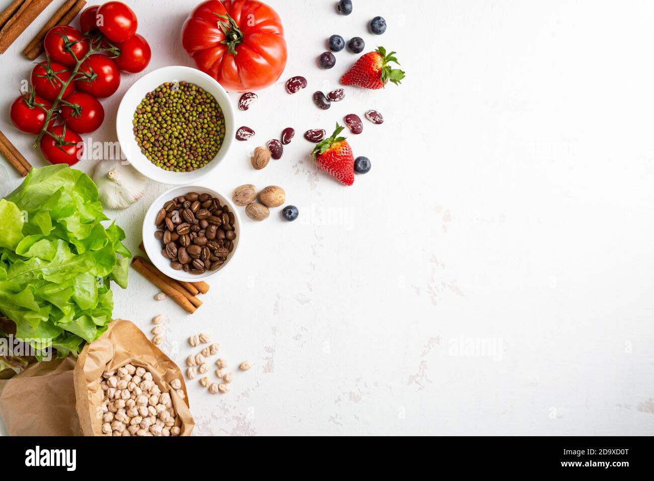 White food background with beans and berry Stock Photo - Alamy