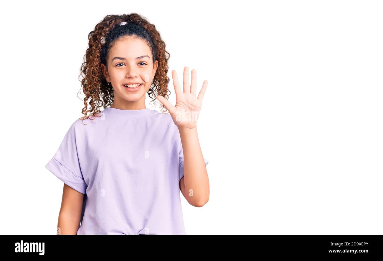 Beautiful kid girl with curly hair wearing casual clothes showing and ...