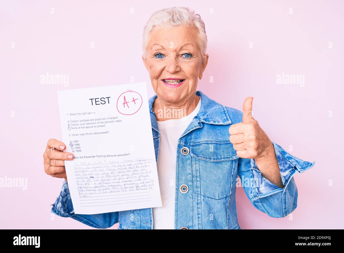 Senior beautiful woman with blue eyes and grey hair showing a passed ...