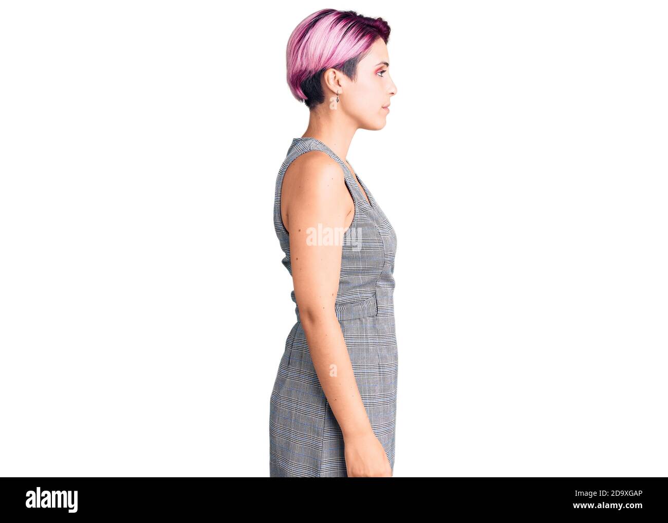 Young beautiful woman with pink hair wearing casual clothes looking to ...
