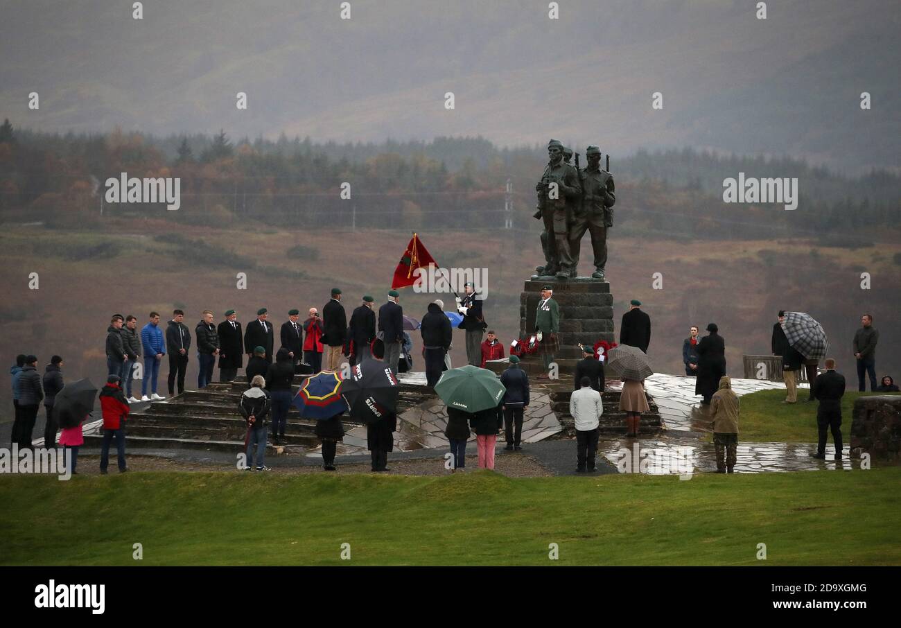 A small number of serving and former Royal Marine Commandos at the Commando Memorial at Spean ...