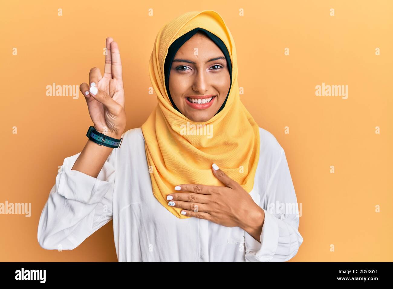 Young brunette arab woman wearing traditional islamic hijab scarf ...