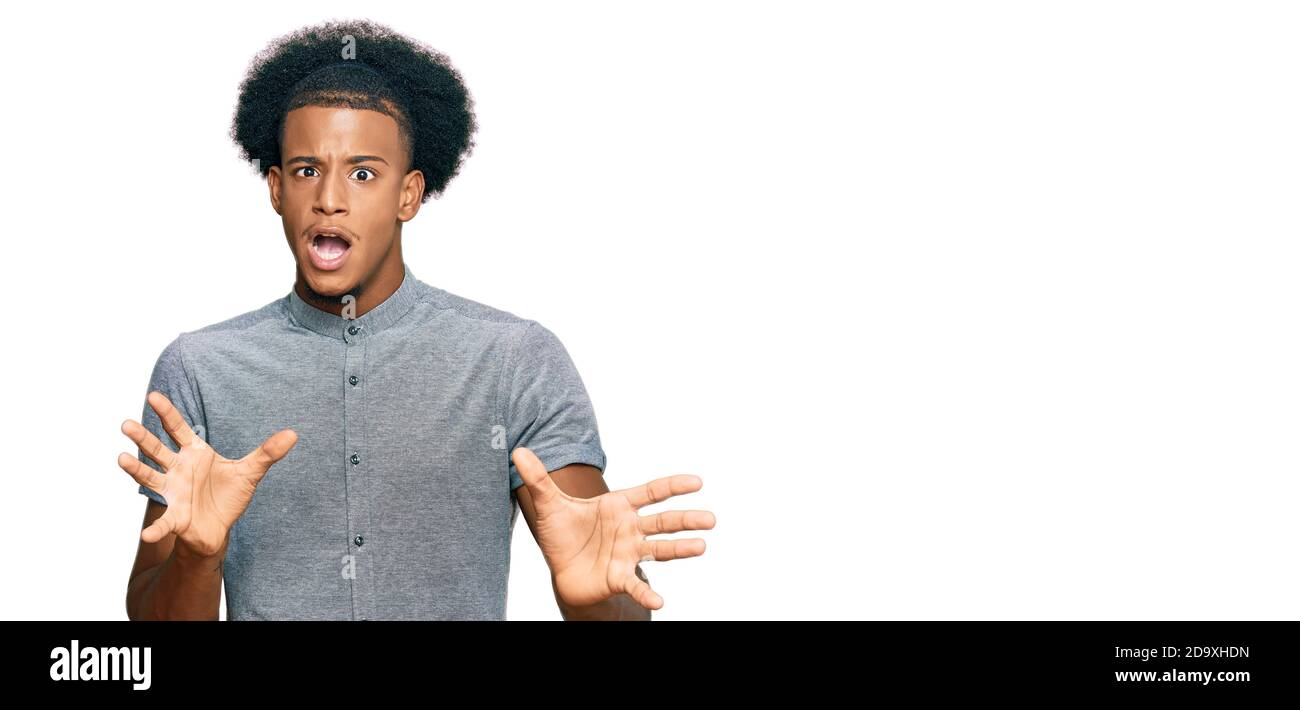 African american man with afro hair wearing casual clothes afraid and ...