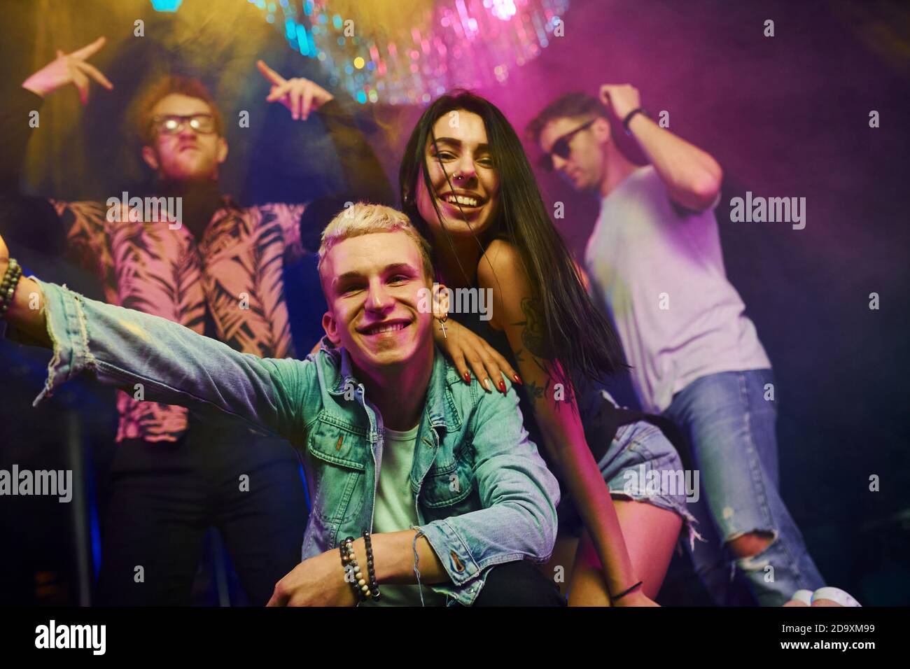 Going crazy and posing for the camera together. Young people is having ...