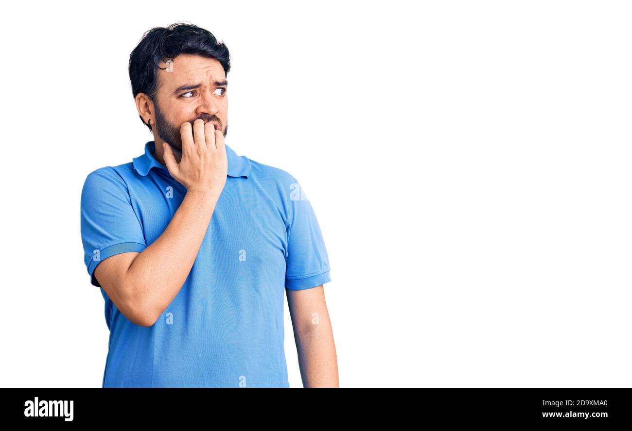 Young hispanic man wearing casual clothes looking stressed and nervous ...