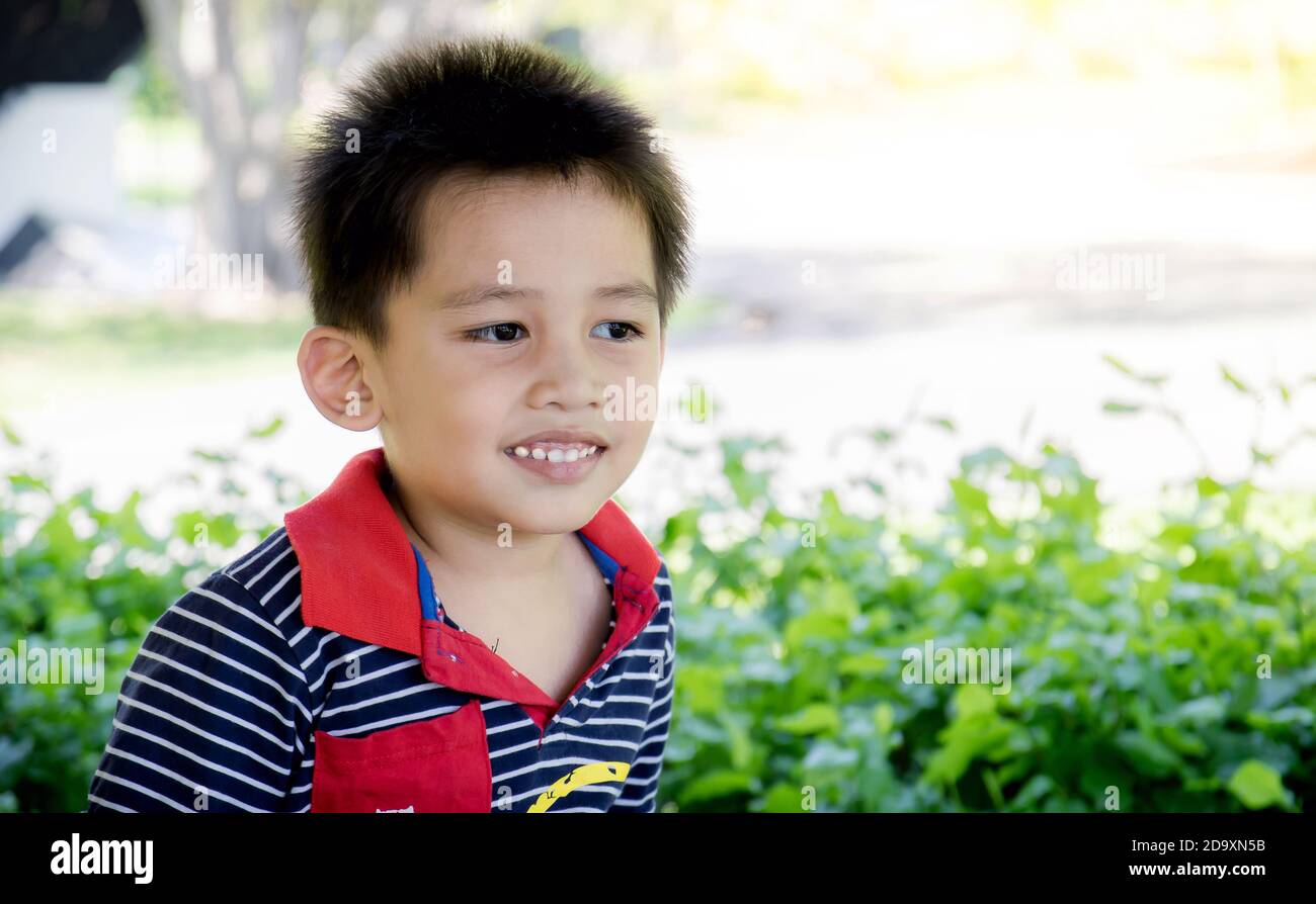 Closeup of the face of Asian boy smiling happily Stock Photo - Alamy