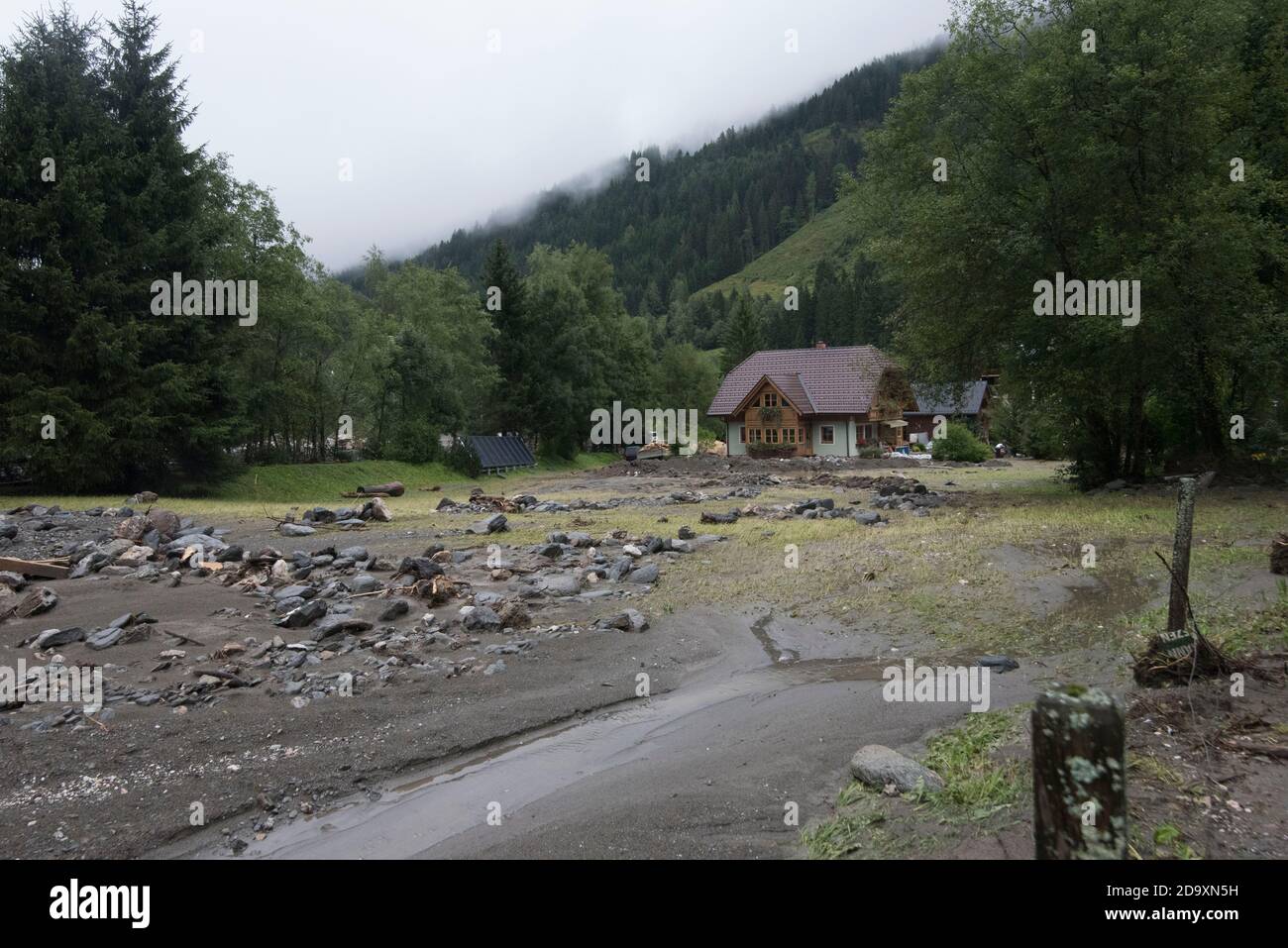 storm damage caused by mudslides, debris and mud after heavy rainfalls ...