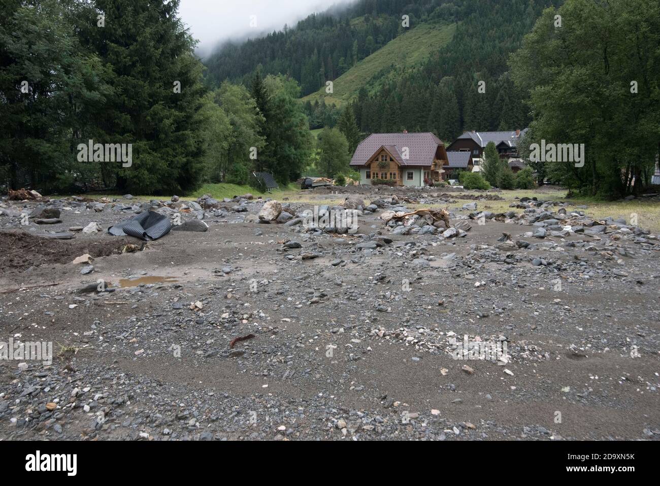 storm damage caused by mudslides, debris and mud after heavy rainfalls ...