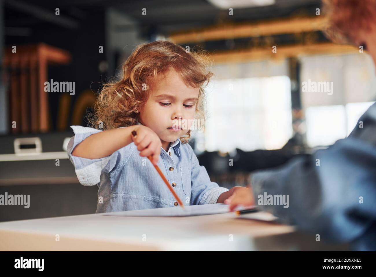 Children have fun in playroom. Kindergarten educational games Stock ...