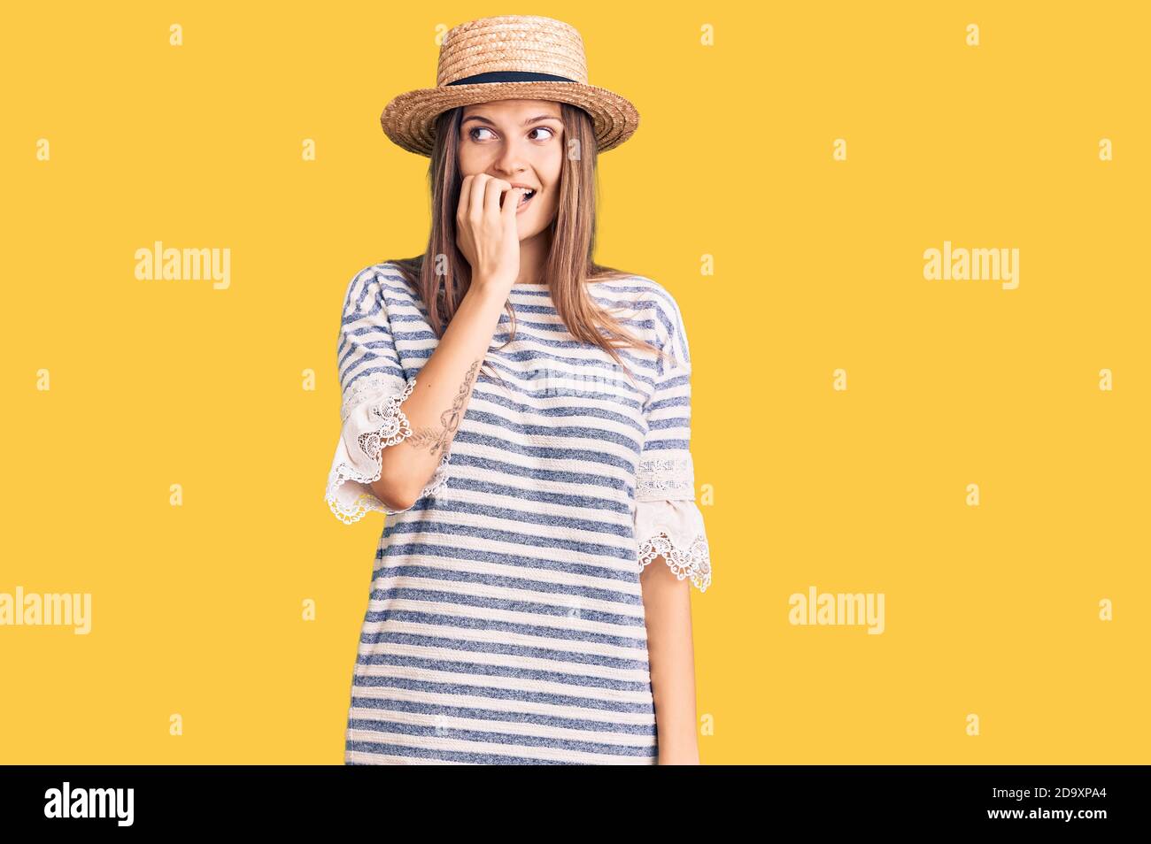 Beautiful caucasian woman wearing summer hat looking stressed and ...