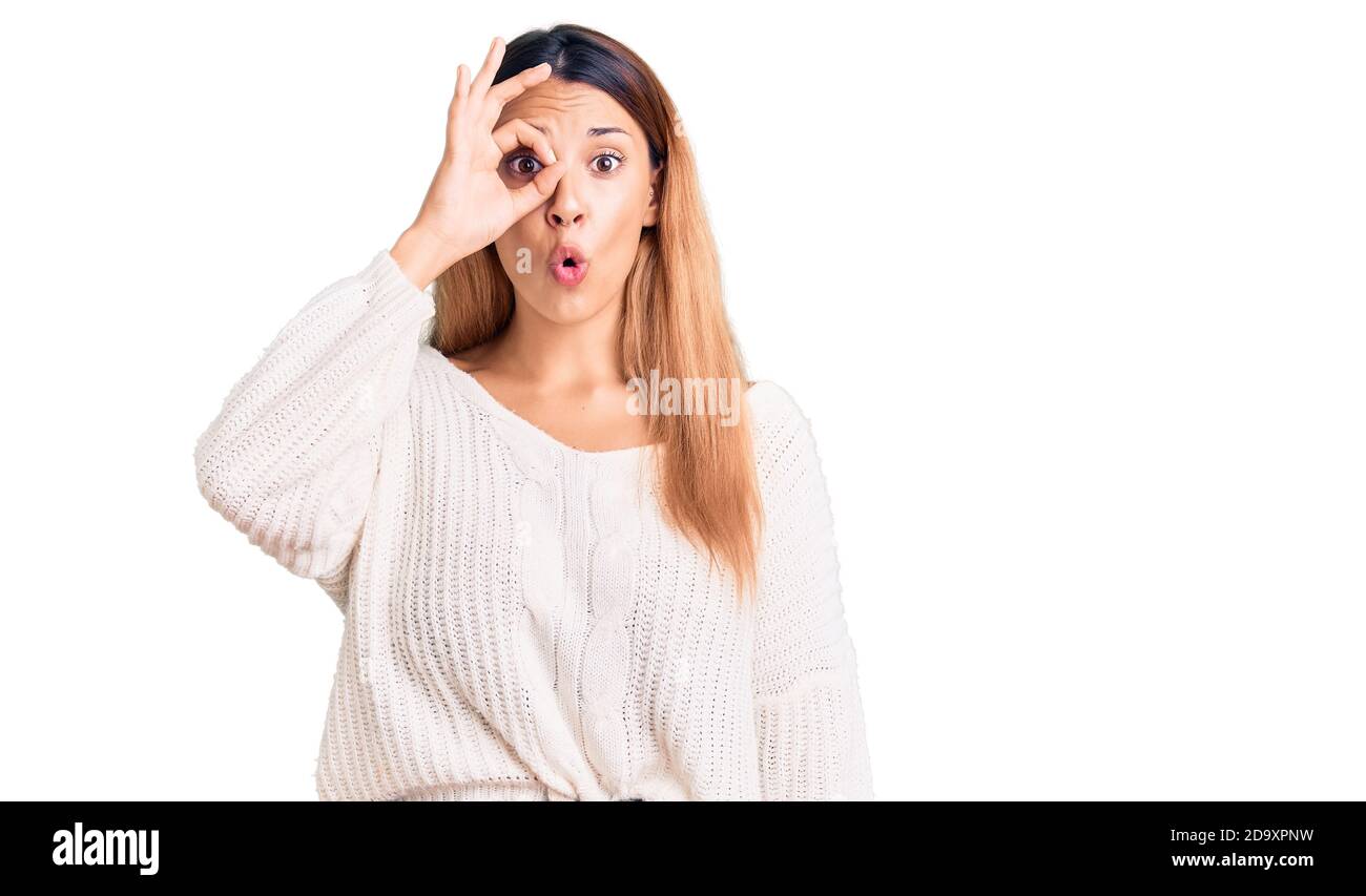 Beautiful young woman wearing casual clothes doing ok gesture shocked ...