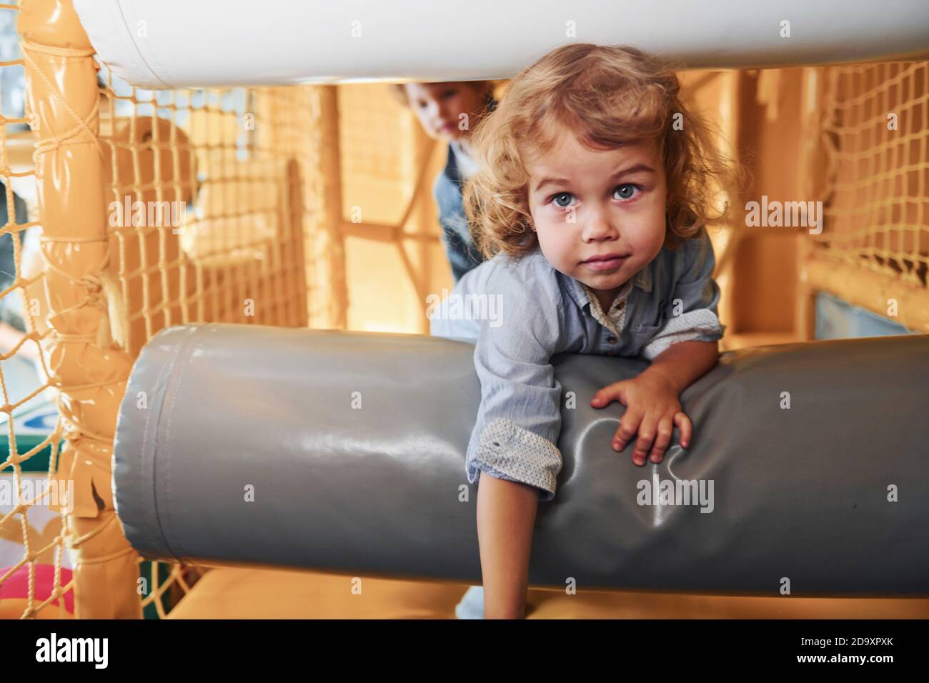 Children have fun in playroom together. Kindergarten games Stock Photo ...