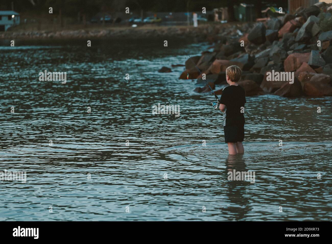 Young boy fishing at the lake Stock Photo - Alamy Young boy fishing at the lake Stock Photo - Alamy
