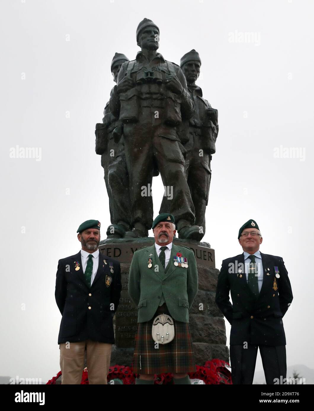 A small number of serving and former Royal Marine Commandos at the Commando Memorial at Spean ...
